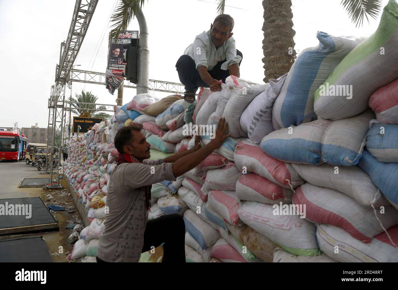 Labours busy preparation the tenth day of Muharram-ul- Haram on the ...