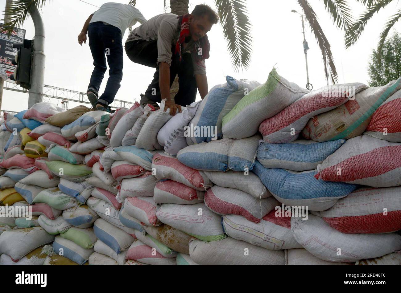 Labours busy preparation the tenth day of Muharram-ul- Haram on the ...