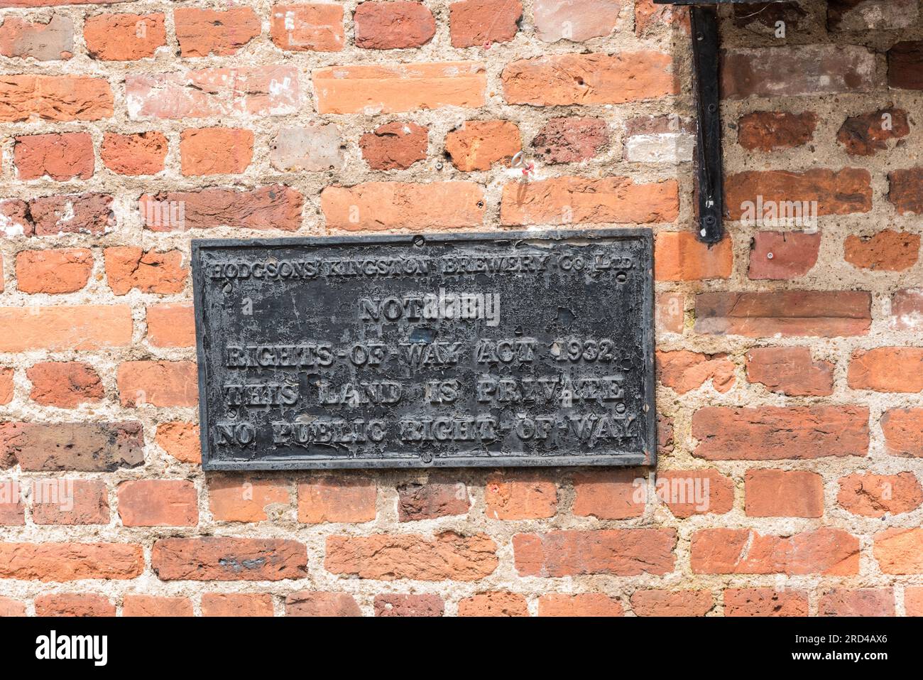 An old wall plague from the 1930s on a pub wall in Hampton Wick Stock ...