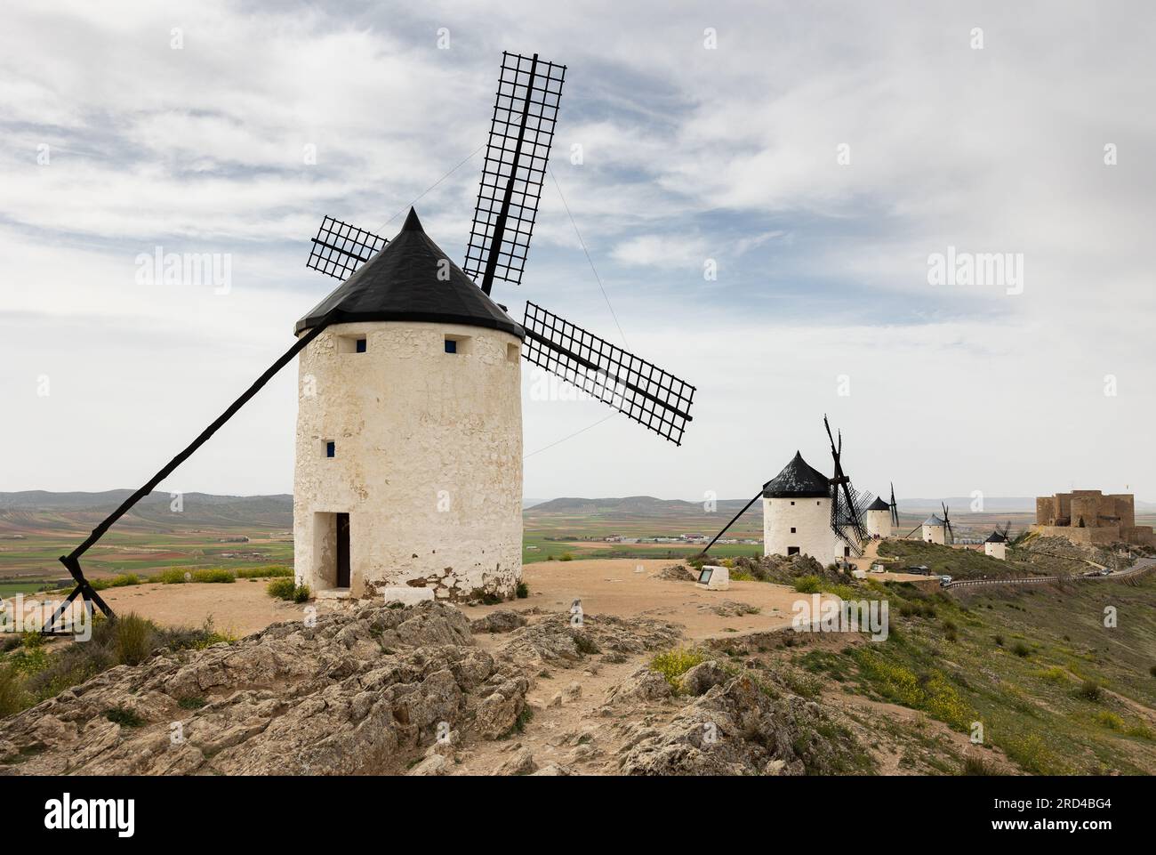 Ancient windmills and castle at Consuegra, Spain Stock Photo - Alamy