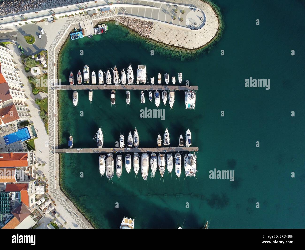 Aerial view of luxury sailing yachts and boats in yacht club near ...