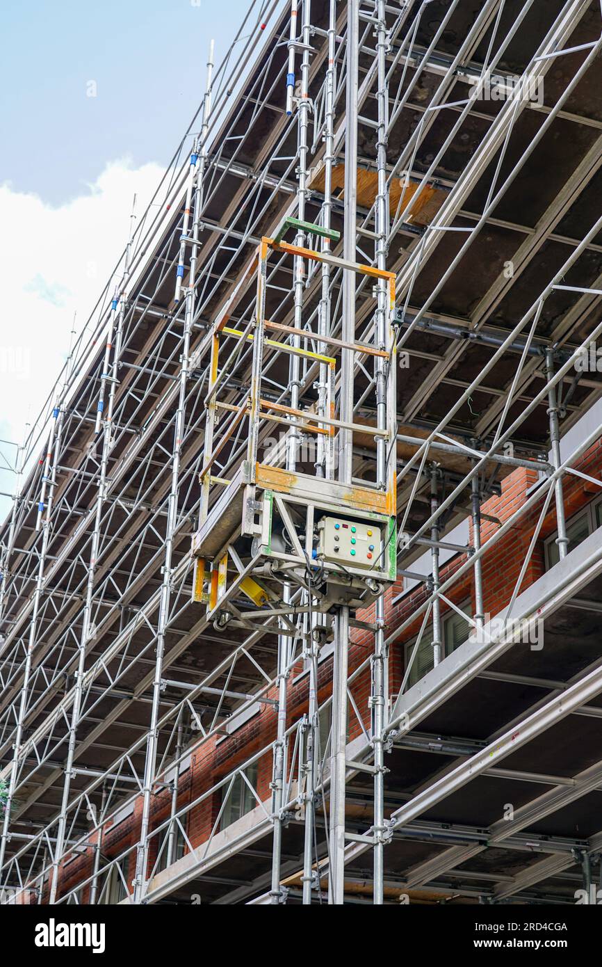 Restoration of the facade of a historic house using scaffolding with ...