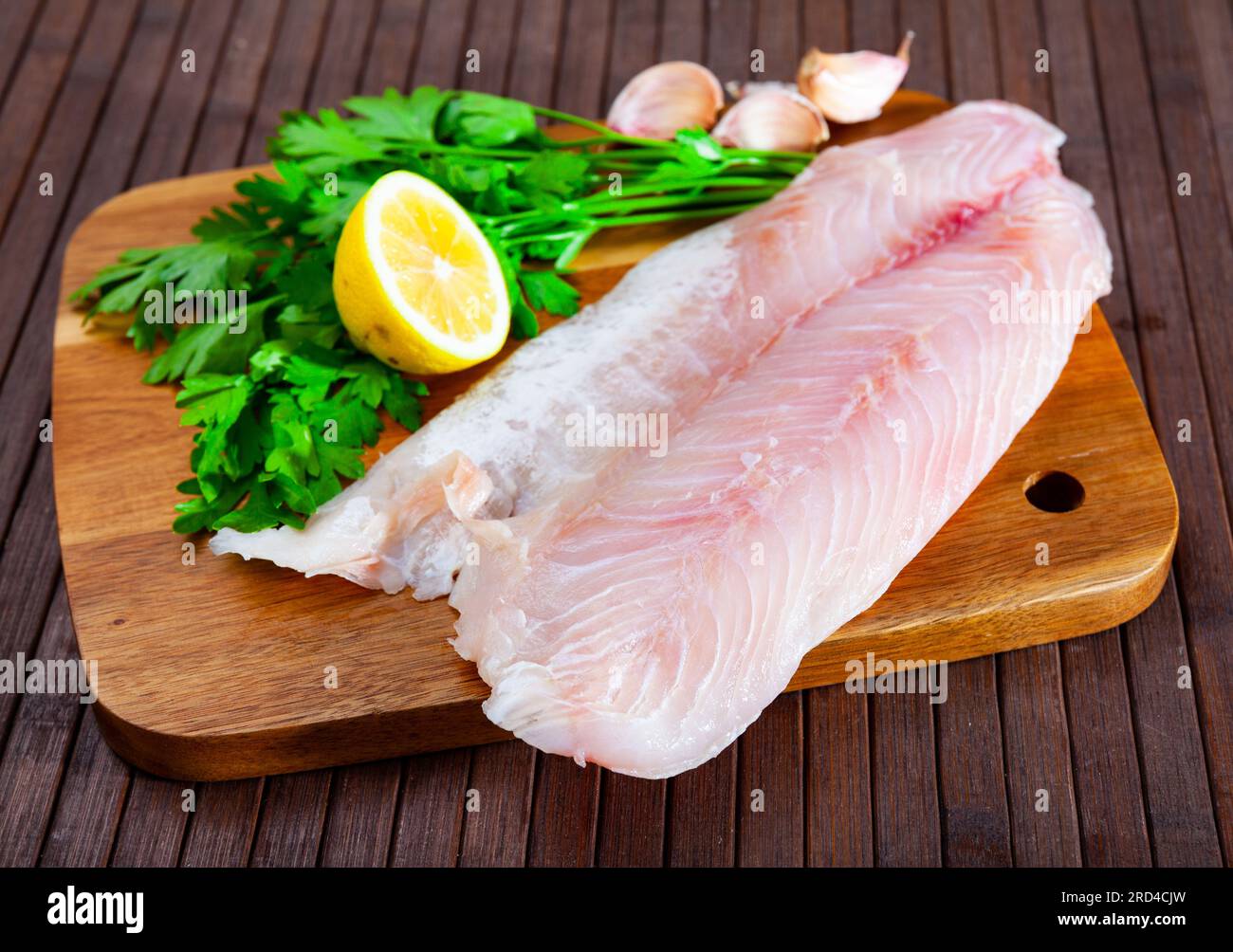 Raw perch fish fillet with condiments Stock Photo - Alamy