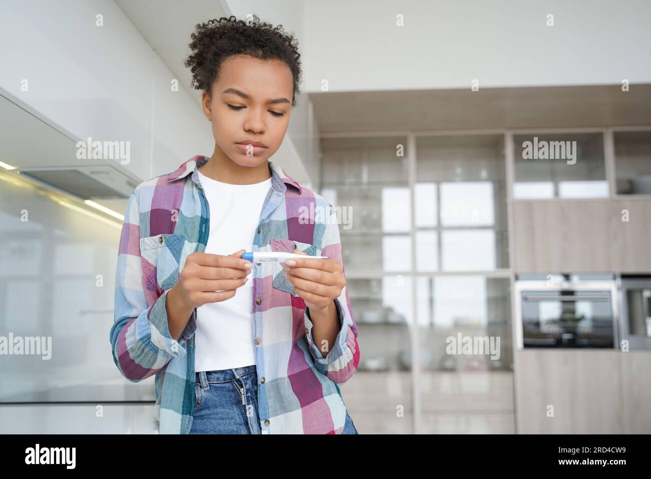 Teenager fever thermometer hi-res stock photography and images - Alamy