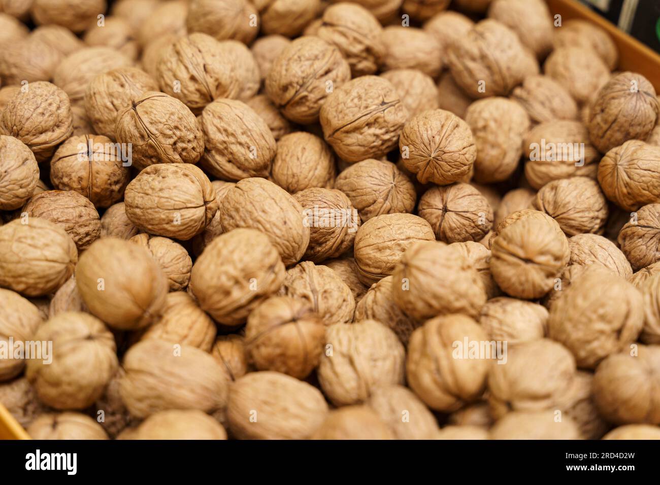 Showcase with walnuts. Food market Background Stock Photo - Alamy