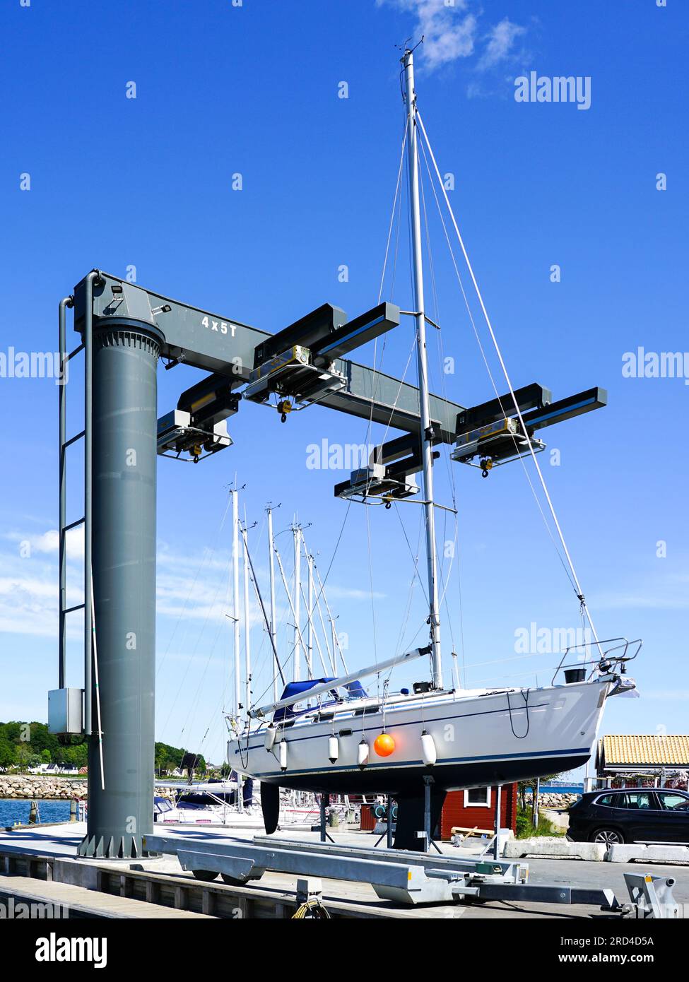 The yacht lifted ashore by a sailboat lift for the maintenance of the ...