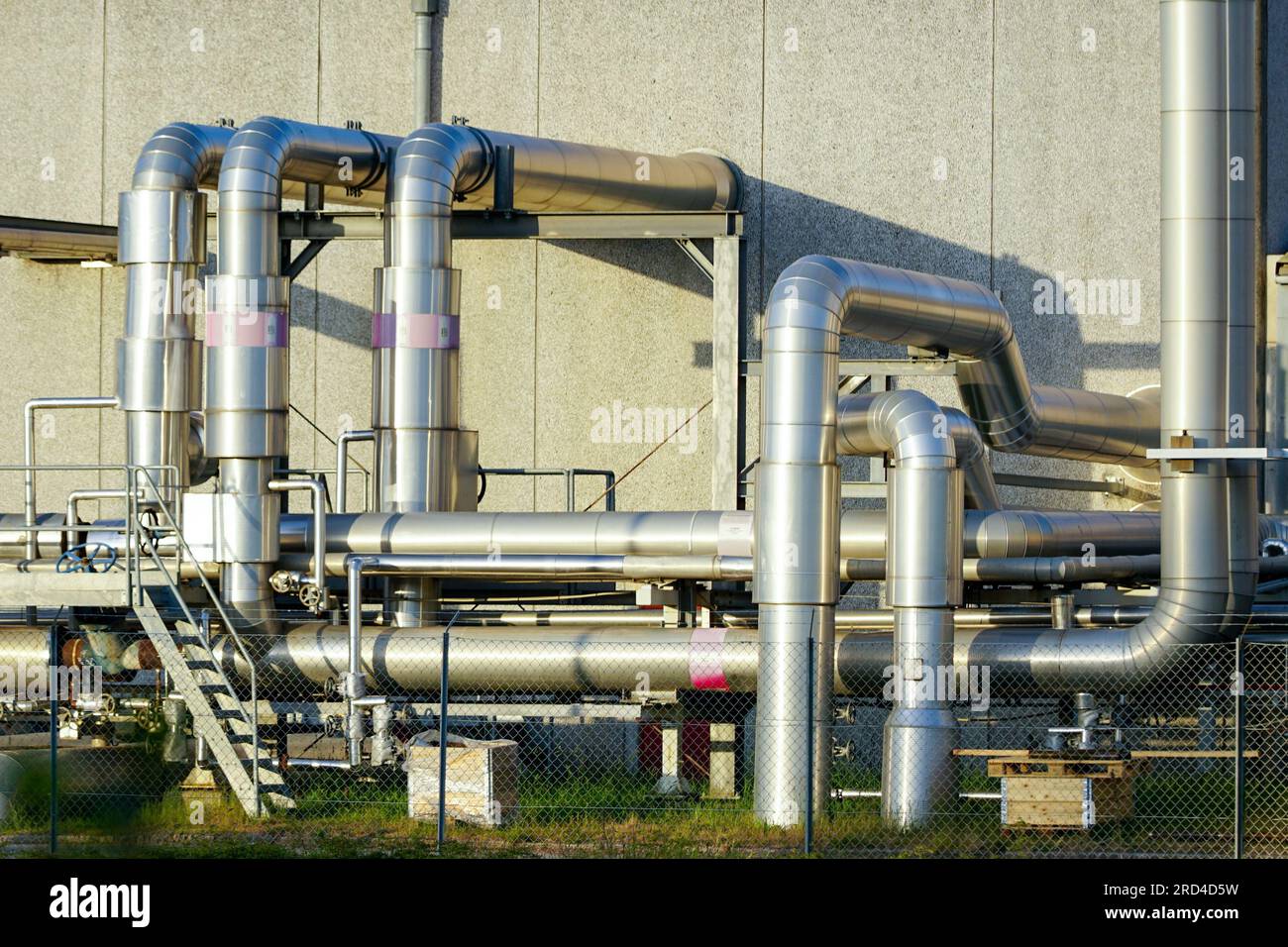 Abstract industrial system of many stainless steel pipes outside a heat ...