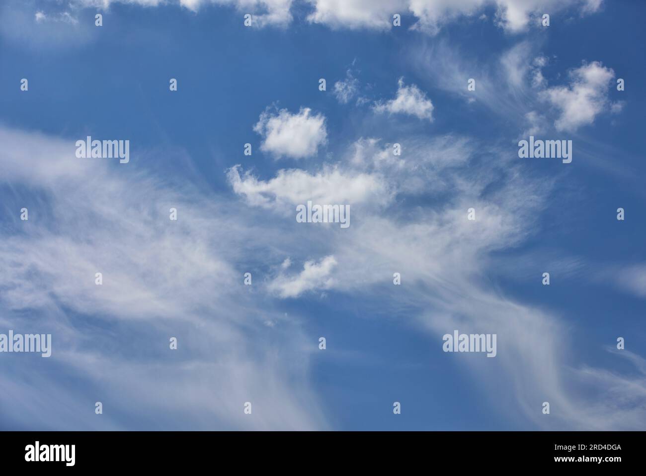 Ornate haze in the blue sky with white clouds texture Stock Photo - Alamy