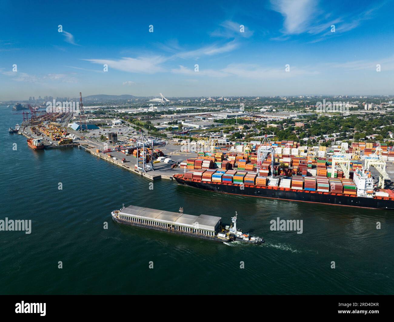 Aerial view of the port of Montreal along the St. Lawrence River with ...