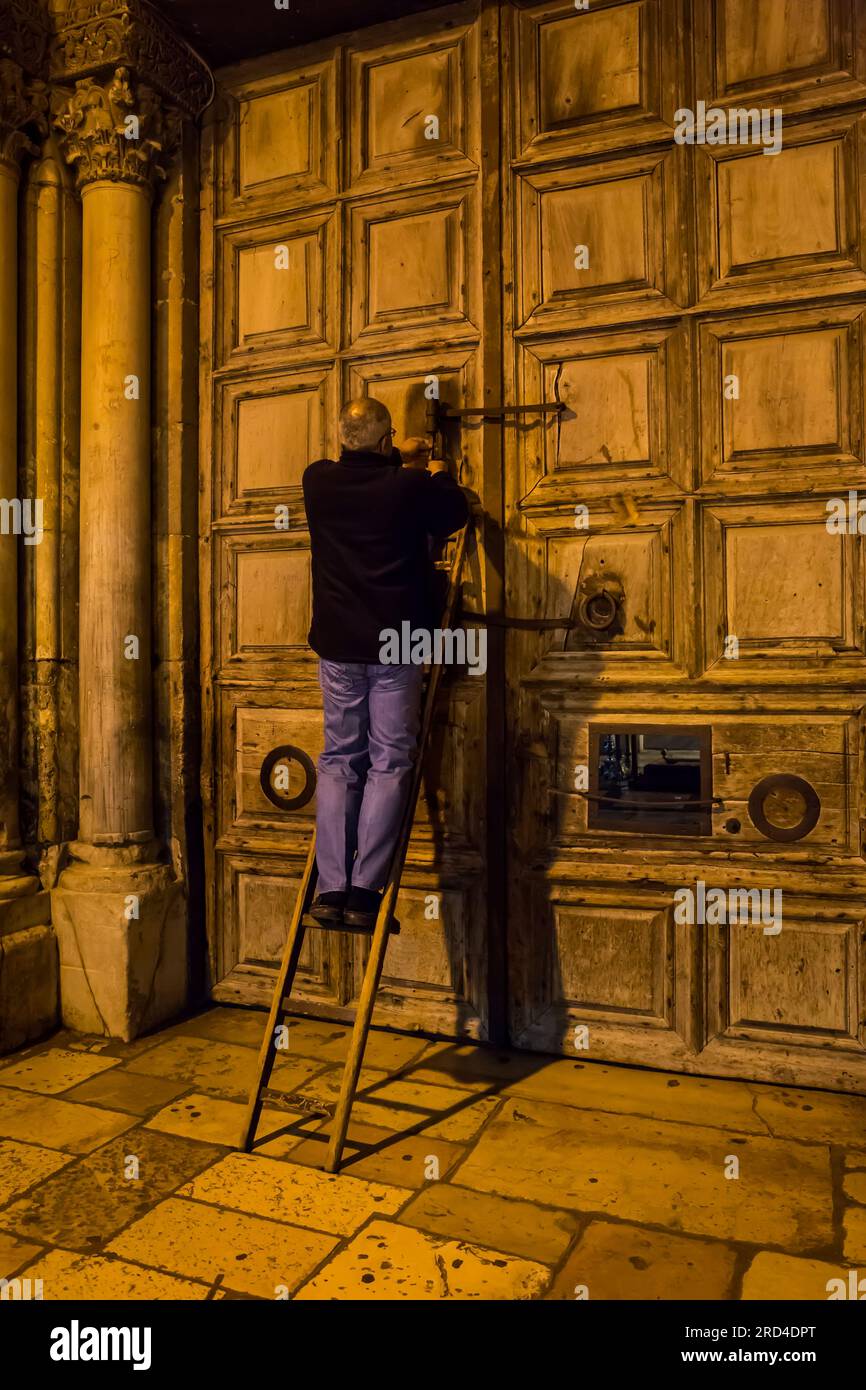 The doorman doing the ritual of closing the gate of the Church of the ...