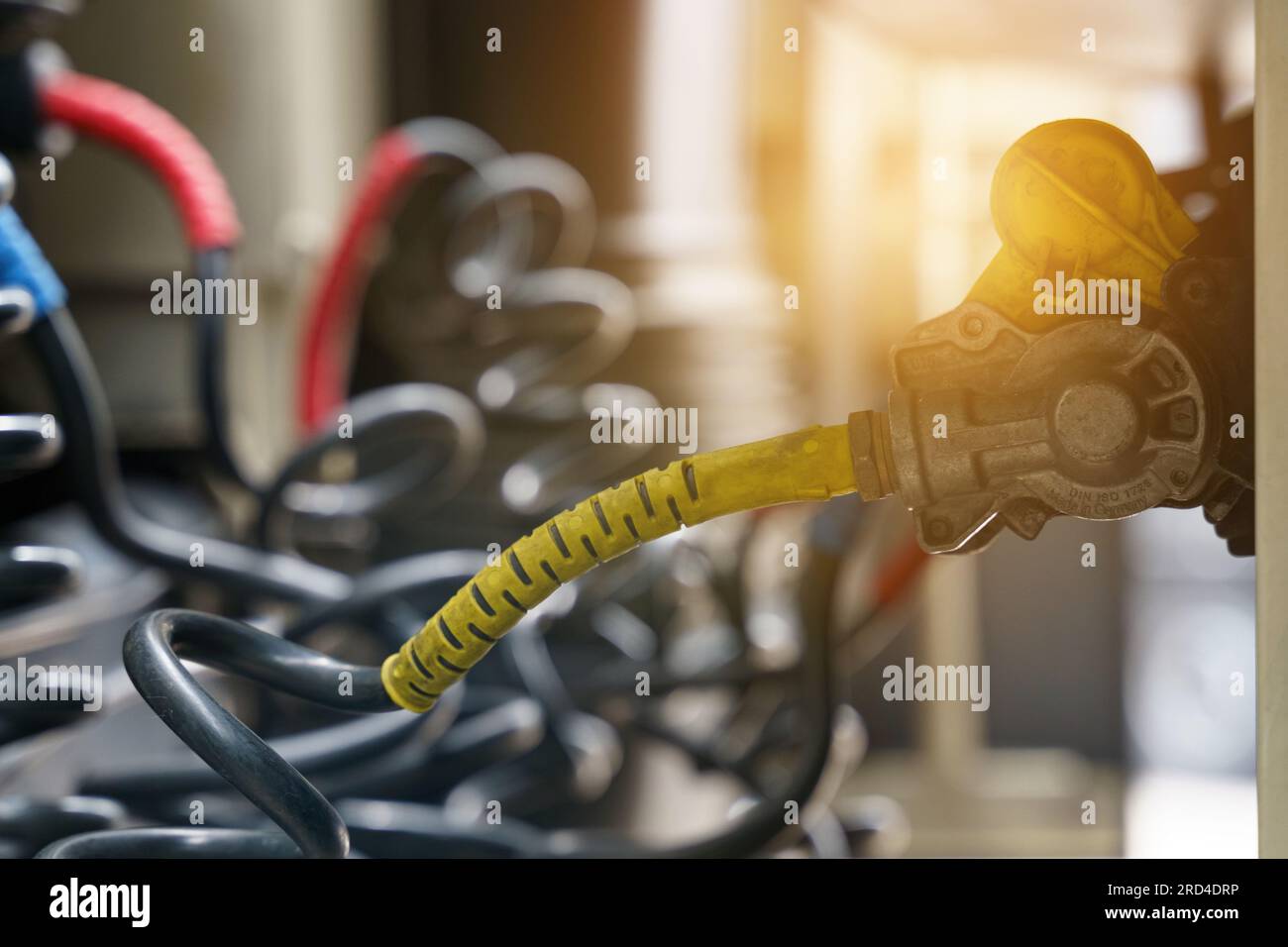 Connecting pneumatic and electrical hoses and cables to a truck semi ...