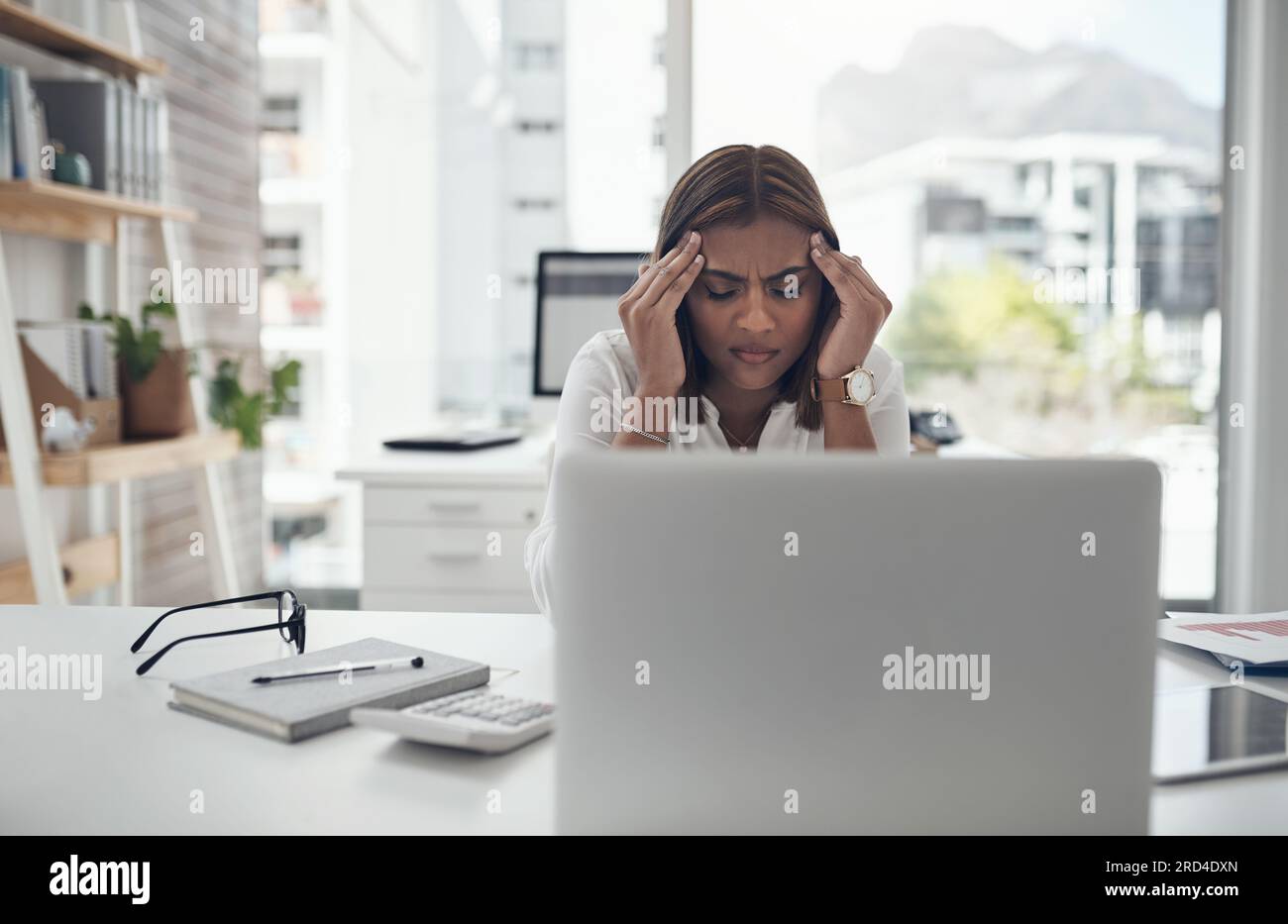 Headache, pain and business woman on laptop for stress, budget problem ...