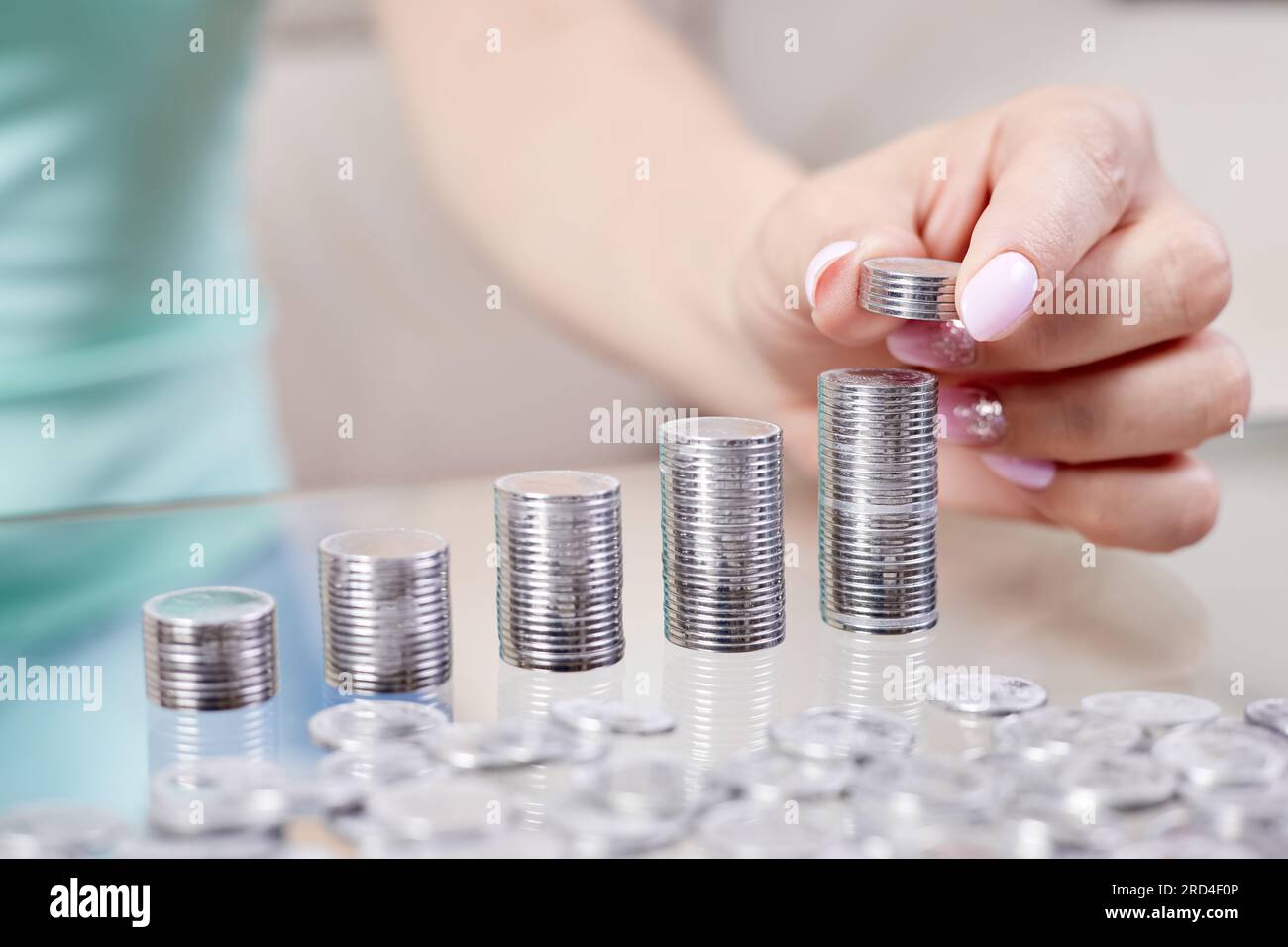 Hand put stack coins money hi-res stock photography and images - Alamy