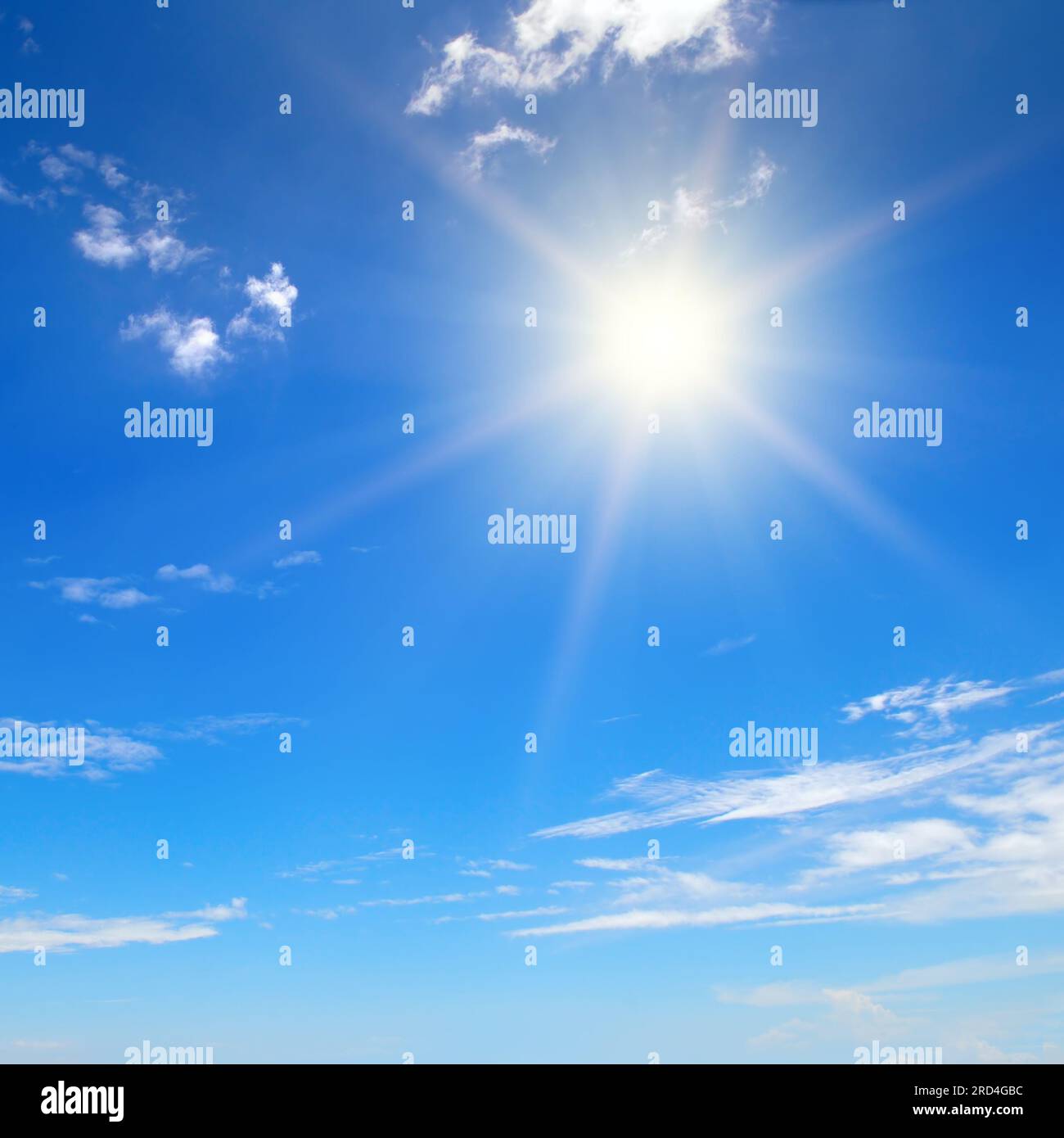 The bright sun, blue sky and light clouds Stock Photo - Alamy