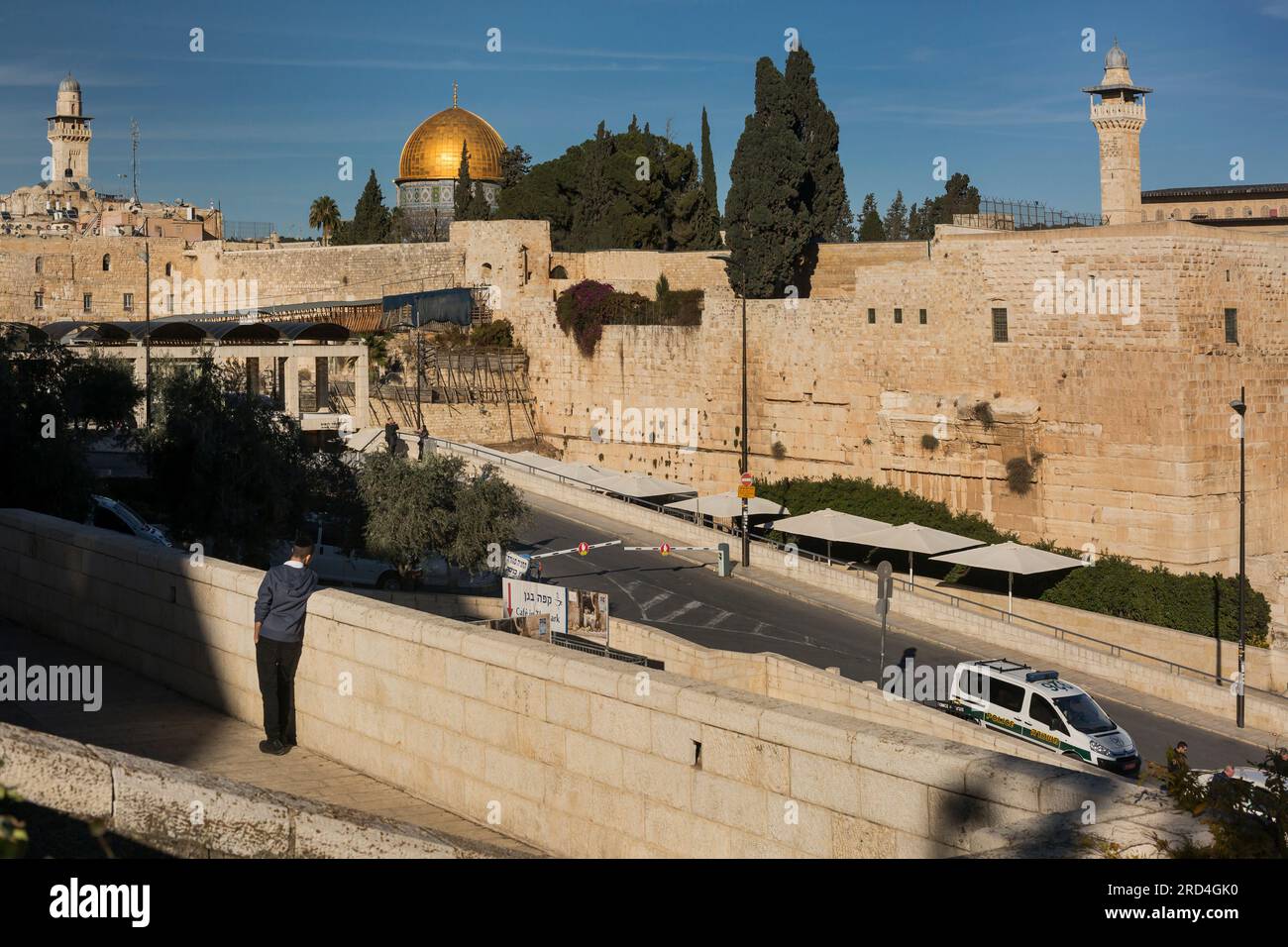 Young Jew having a look at the Western Wall, with the Dome of the Rock ...