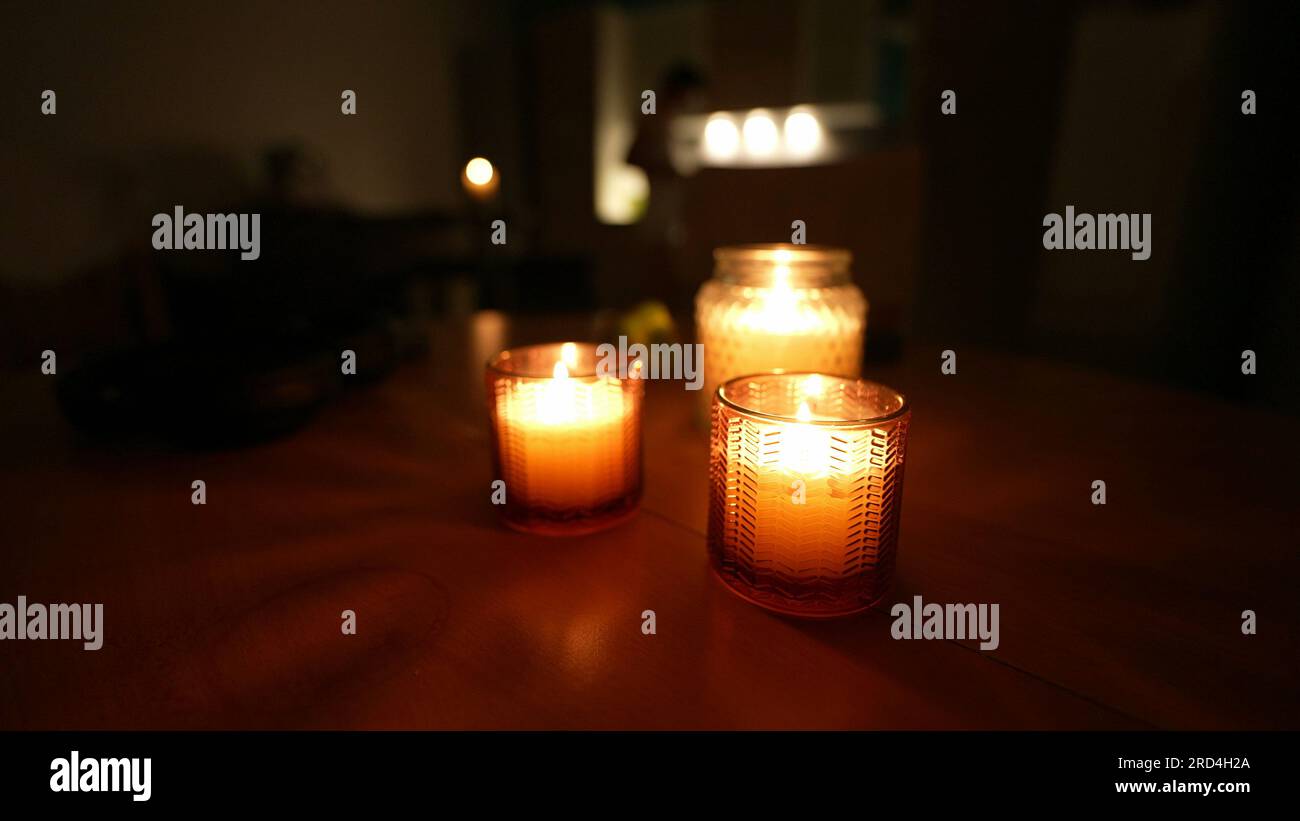 Three romantic candles at night Stock Photo - Alamy
