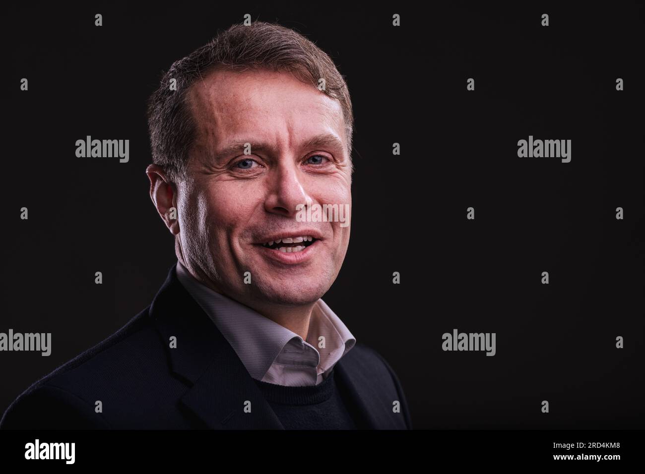 Bust portrait: a middle-aged man chuckles fearlessly at life's changes ...