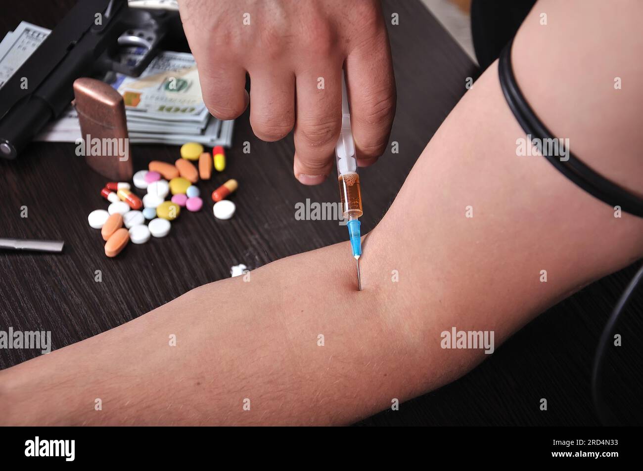 Drug addict man with syringe in action Stock Photo - Alamy