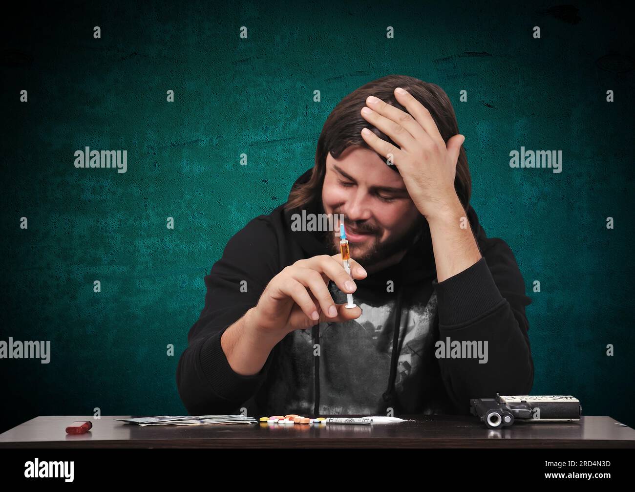drug addict man with syringe and drags on table Stock Photo - Alamy