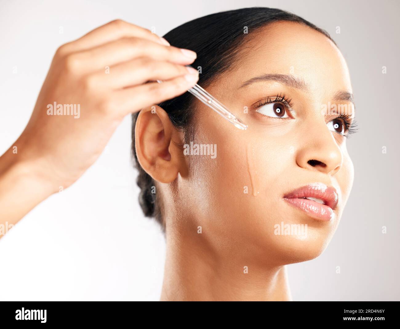 Woman, face and serum for skincare, hydration or healthcare in retinol ...