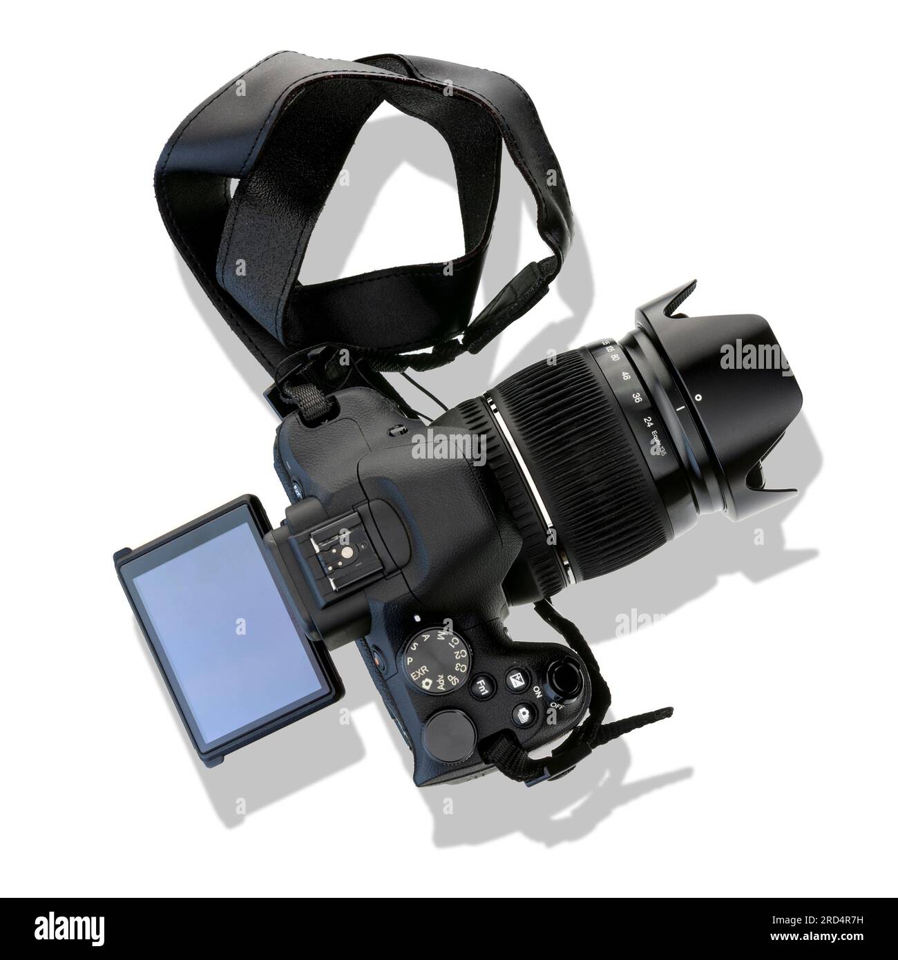 A lying mirrorless camera on a white background. Black photo camera ...