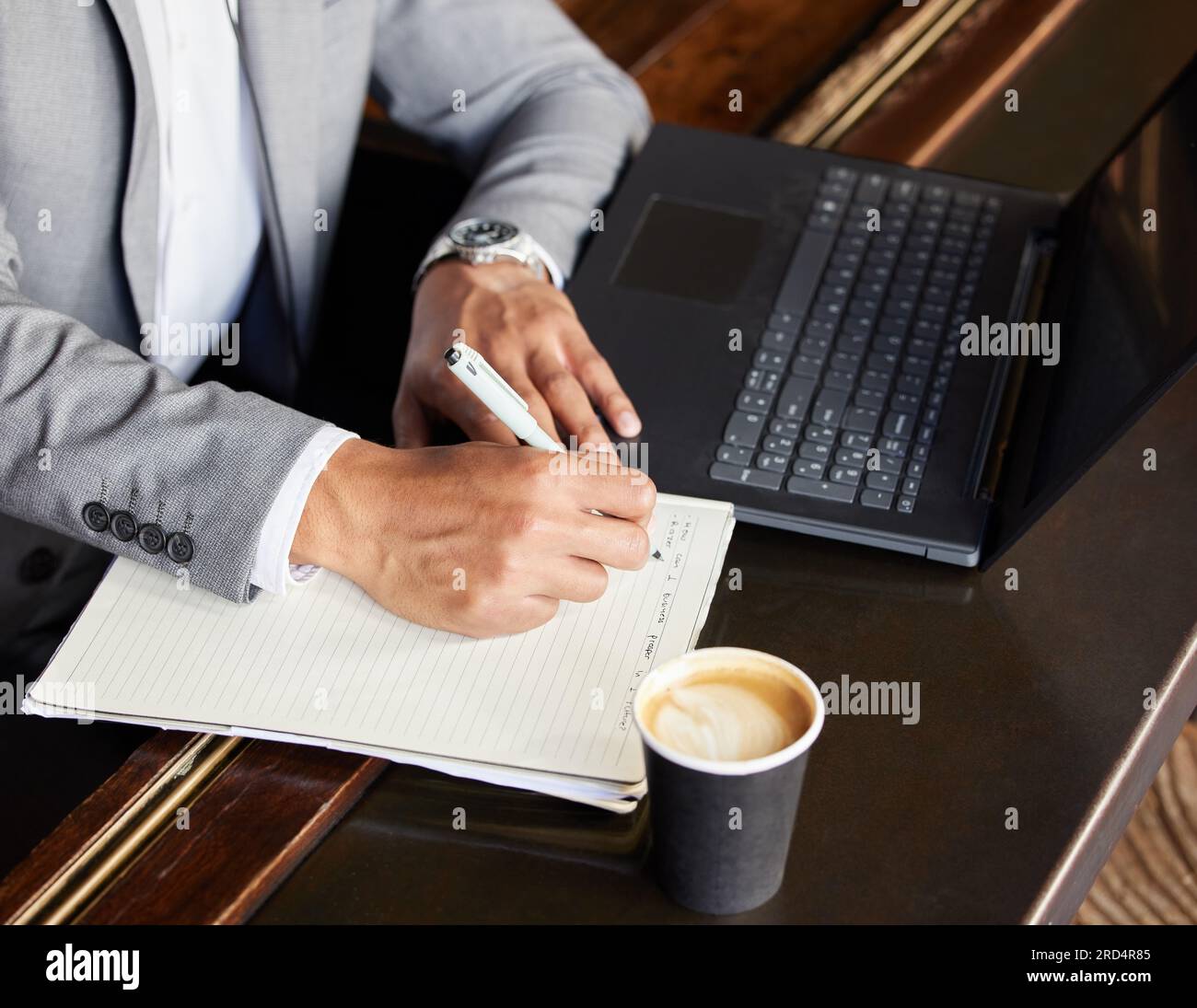 Business man, hands and writing at coffee shop with entrepreneur notes ...