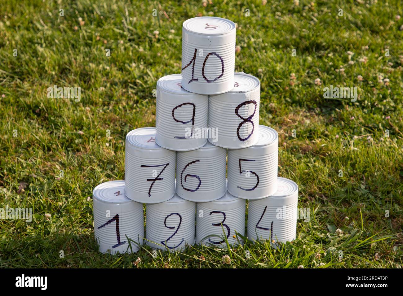 stacked tin can pyramid game for can knockdown games at funfair Stock ...