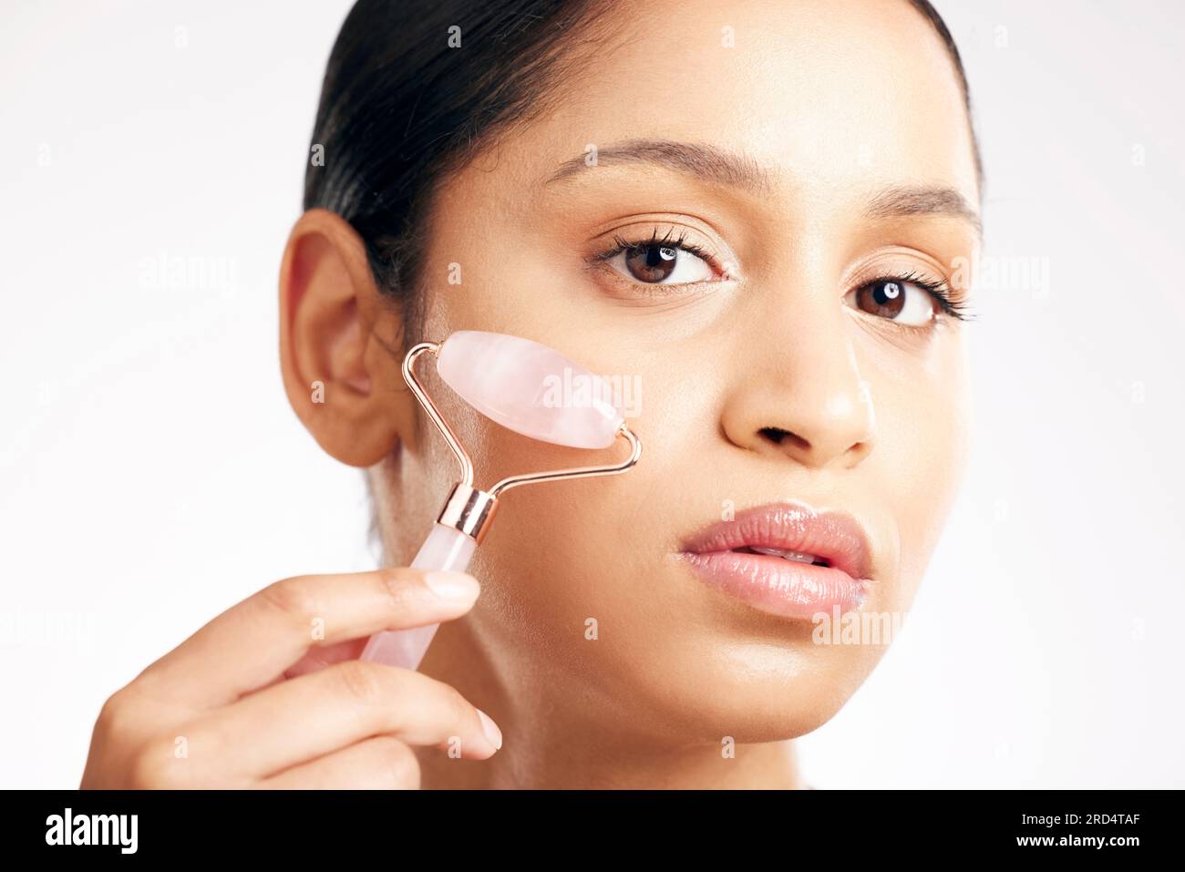 Woman, portrait and face with derma roller in healthcare, skincare or ...