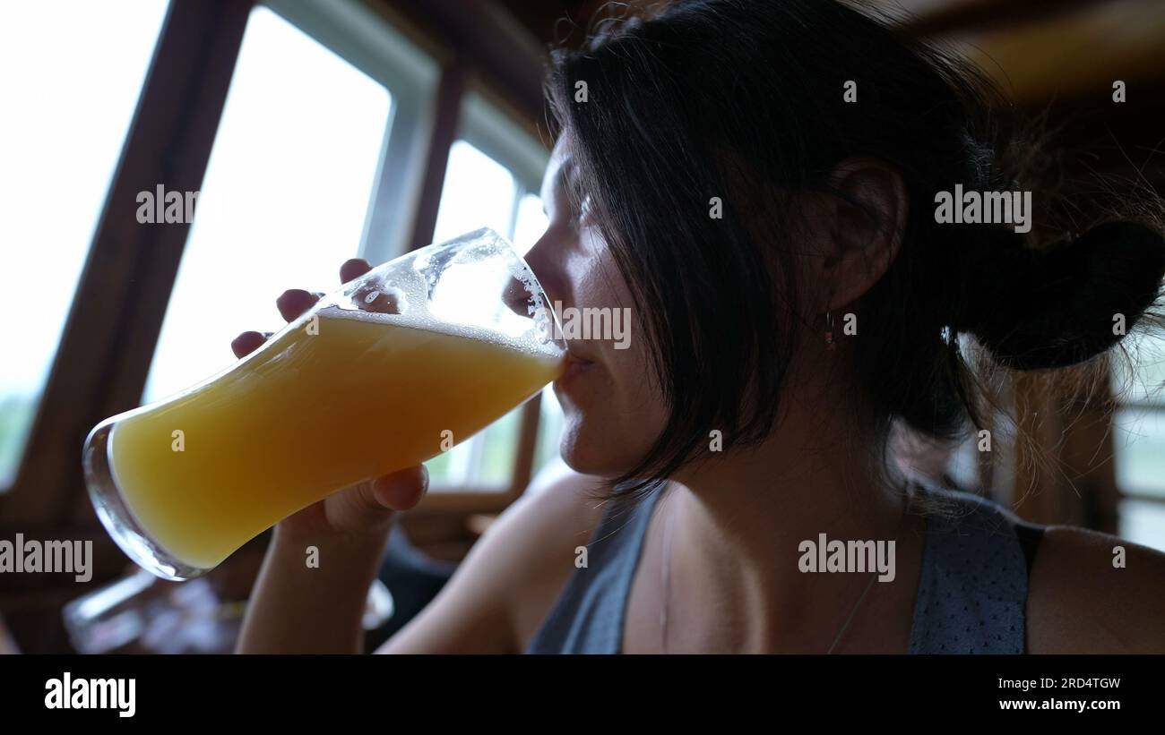 Person drinking draft beer woman drinks alcoholic beverage Stock Photo ...