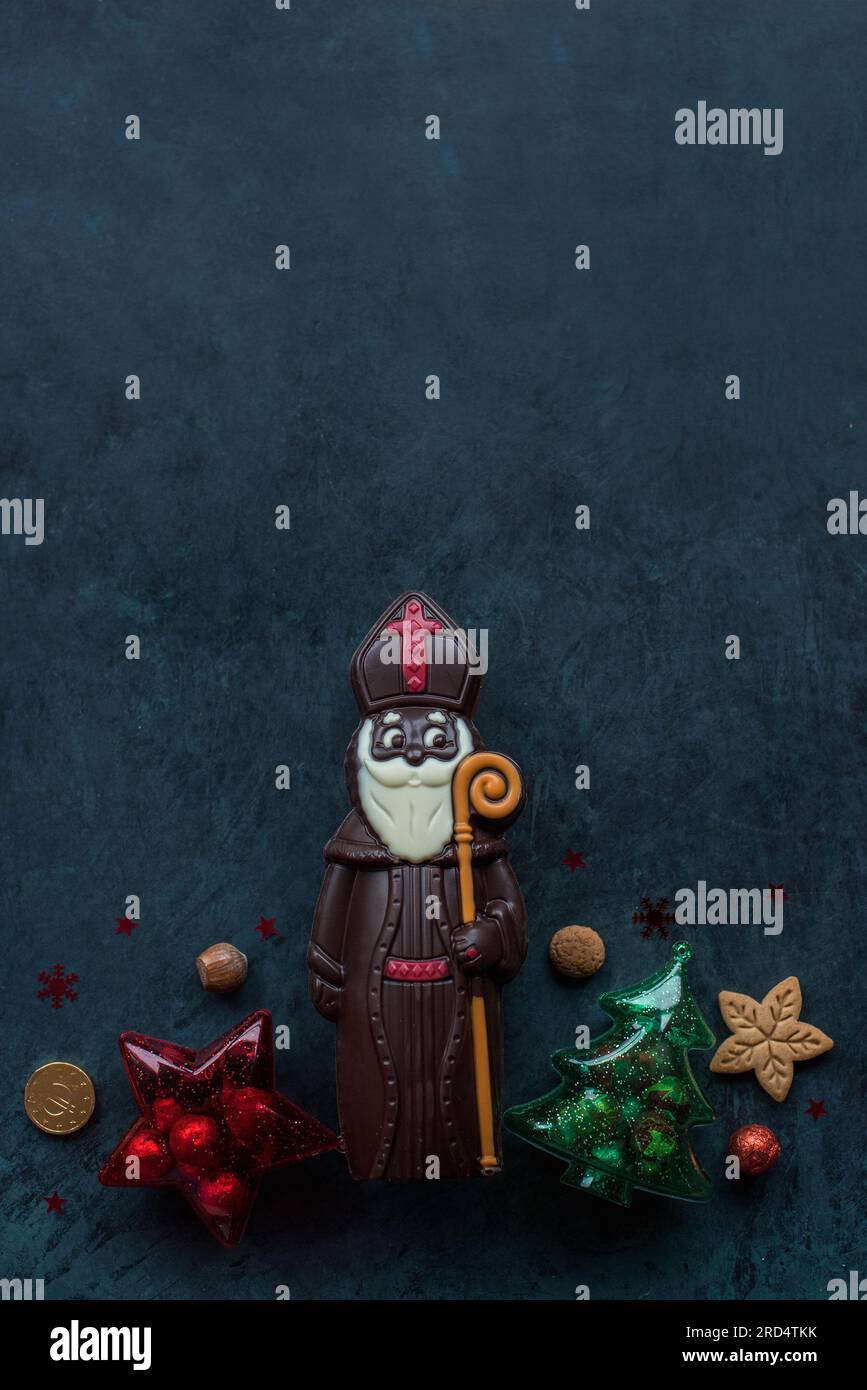 Saint Nicholas chocolate with gifts on a blue background Stock Photo ...