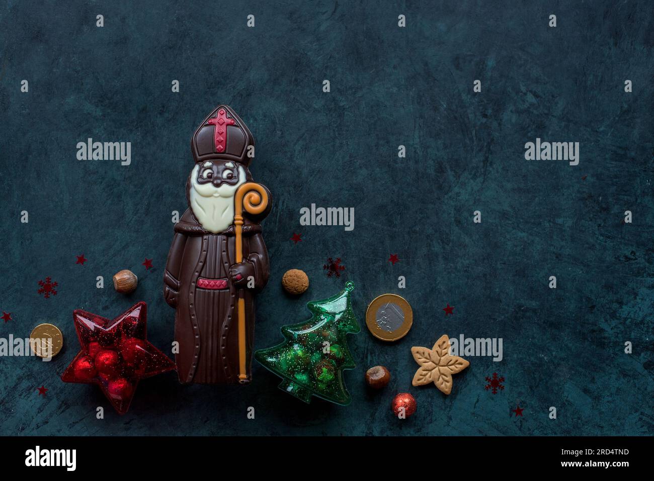 Saint Nicholas chocolate with gifts on dark background with place for ...