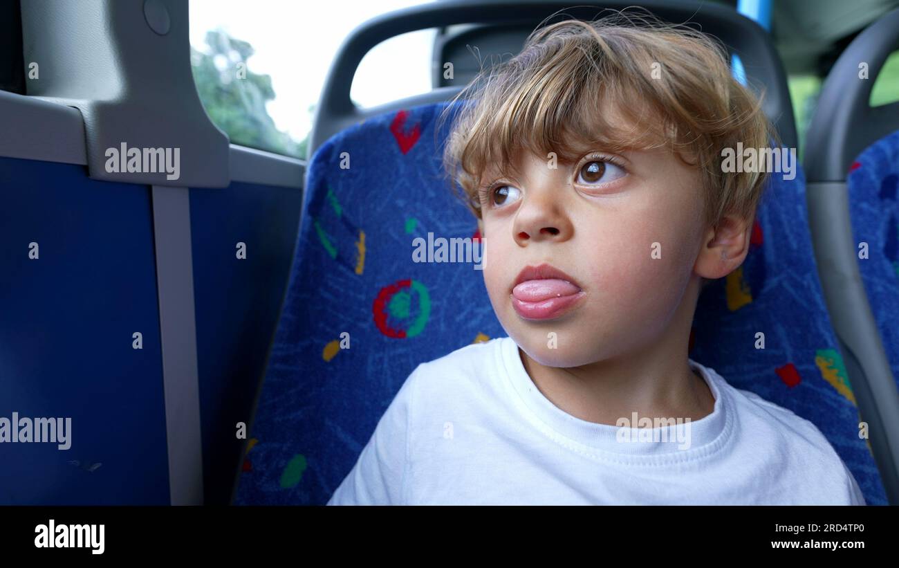 One thoughtful child riding bus passenger kid on public transportation ...