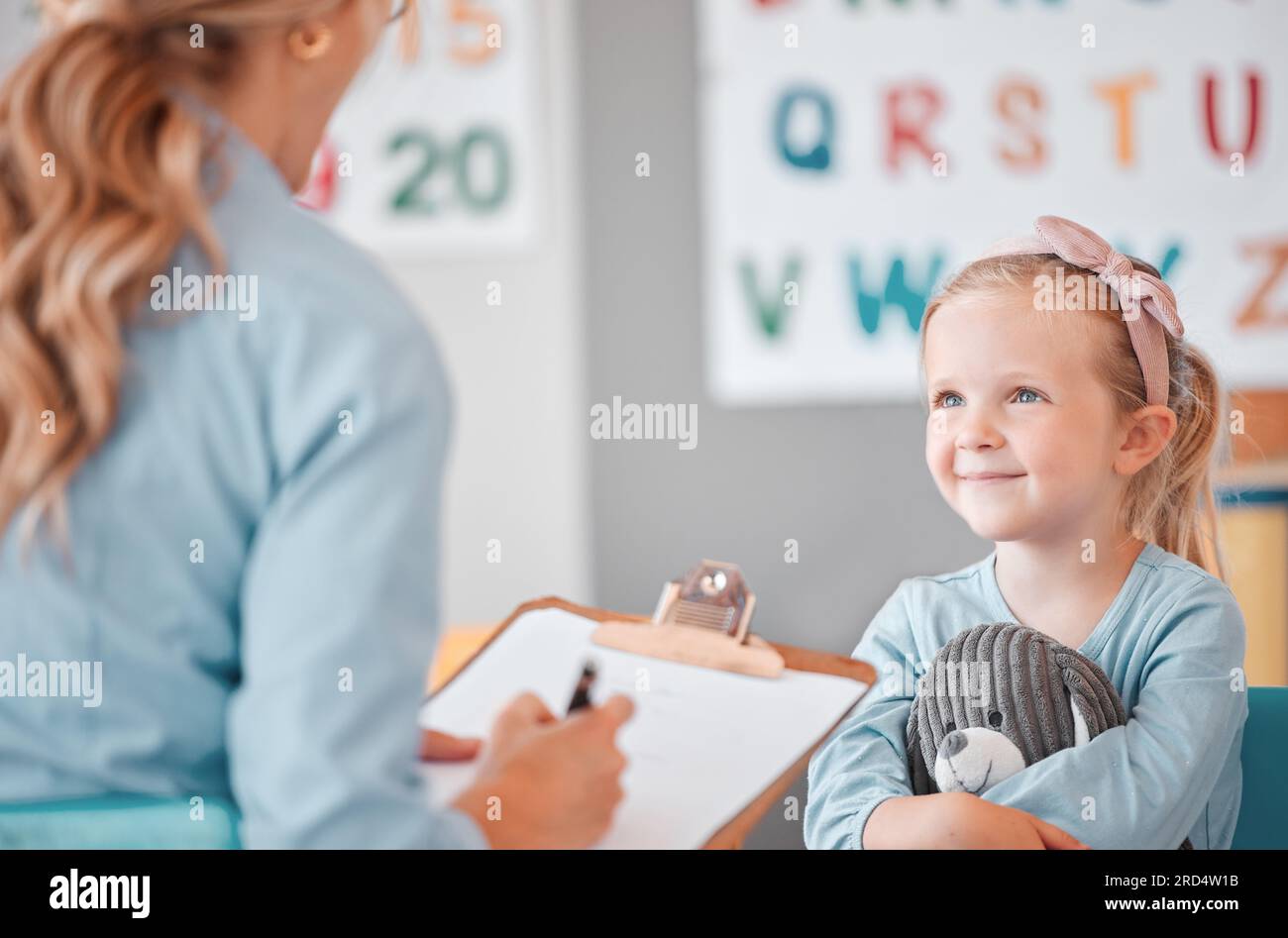 Girl child, psychologist and writing with notes, smile and listening ...