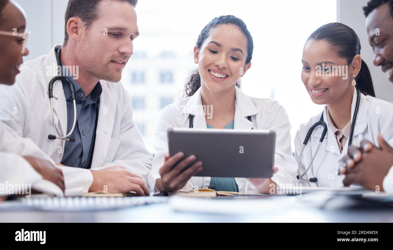Healthcare, tablet and collaboration with a team of doctors in the ...