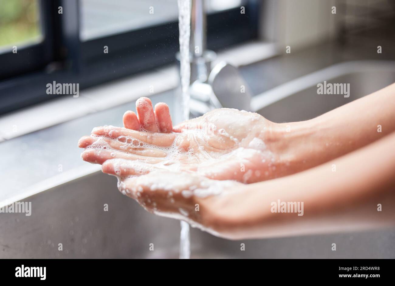 Water, tap and person washing hands with soap for skincare, healthy ...