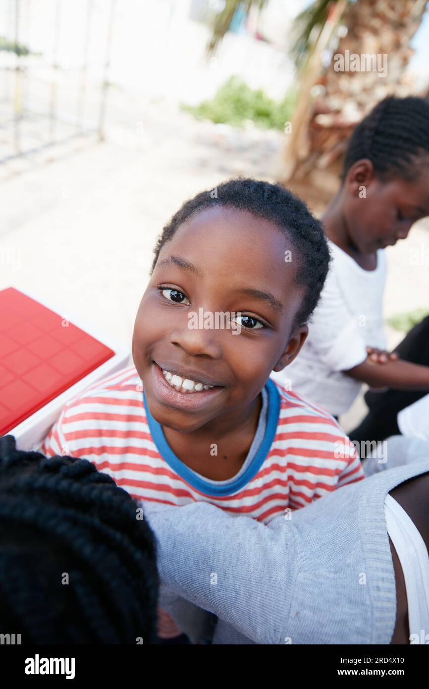 Our children need your help. Shot of kids at a community outreach event ...