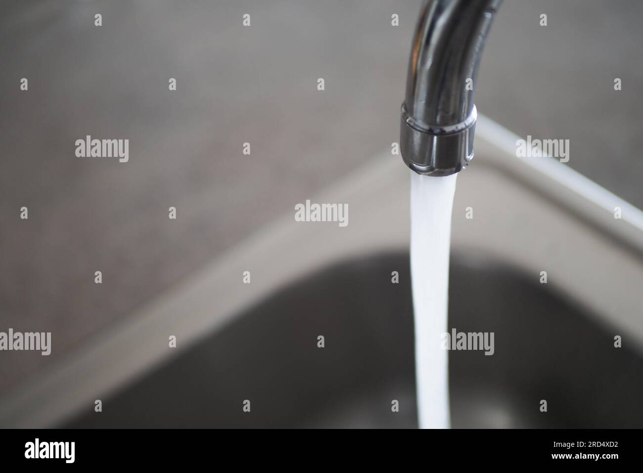 water pouring from a faucet tap slow motion Stock Photo - Alamy