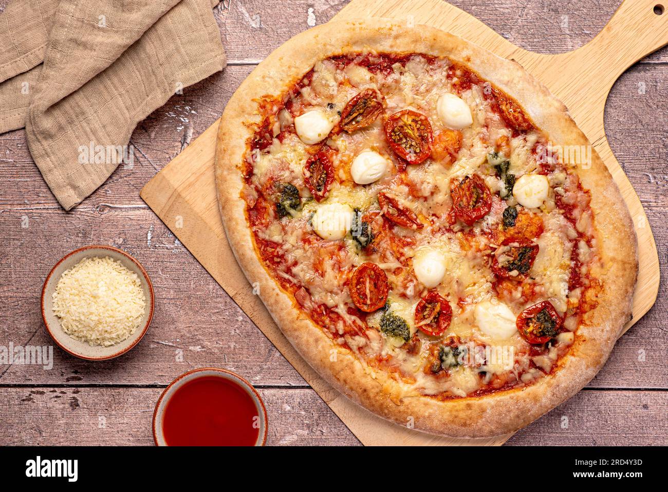 Food photography of pizza; mozzarella, dried, tomato, basil, pesto ...