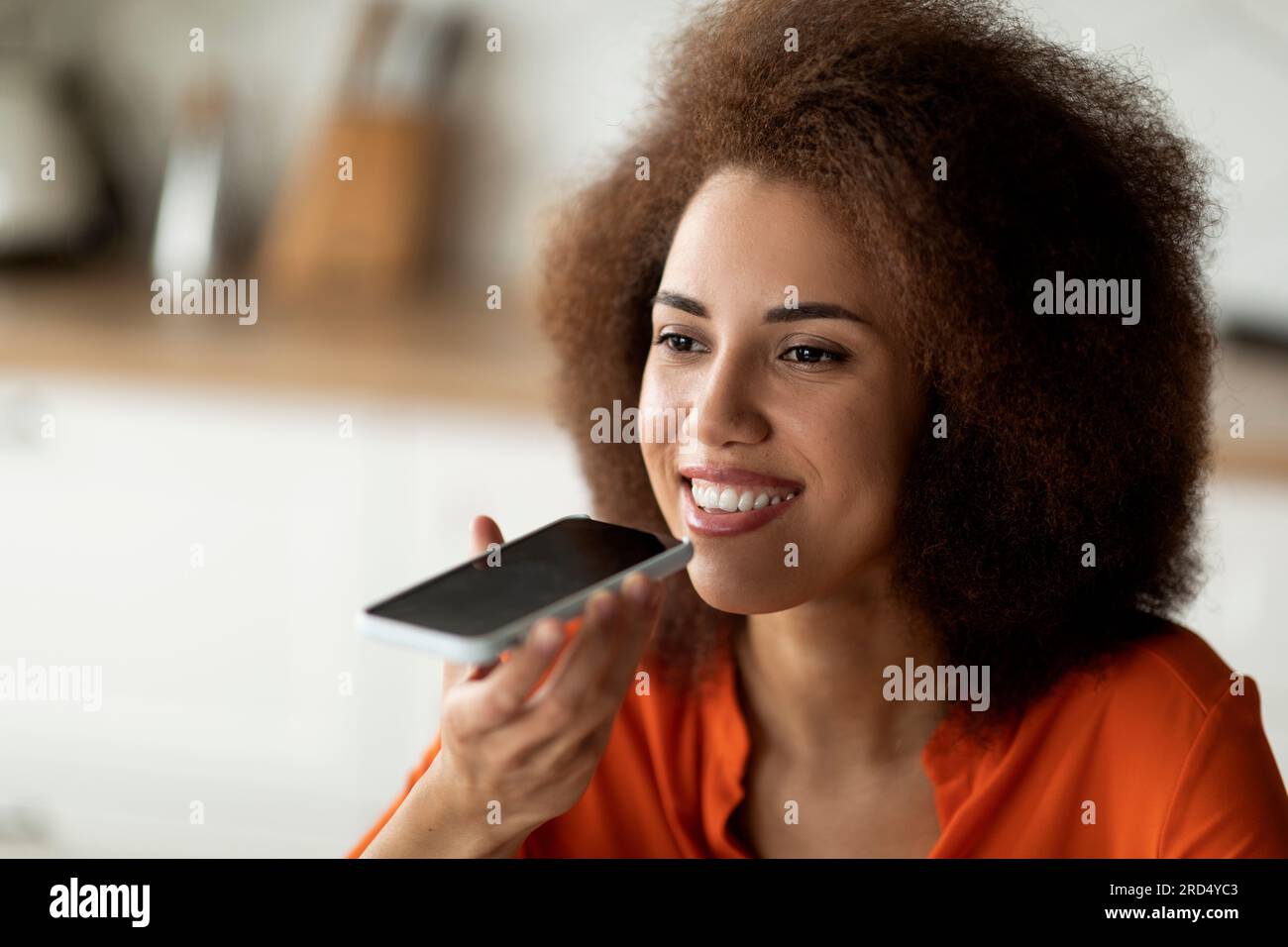 Portrait Of Smiling Young Black Woman Recording Voice Message On ...