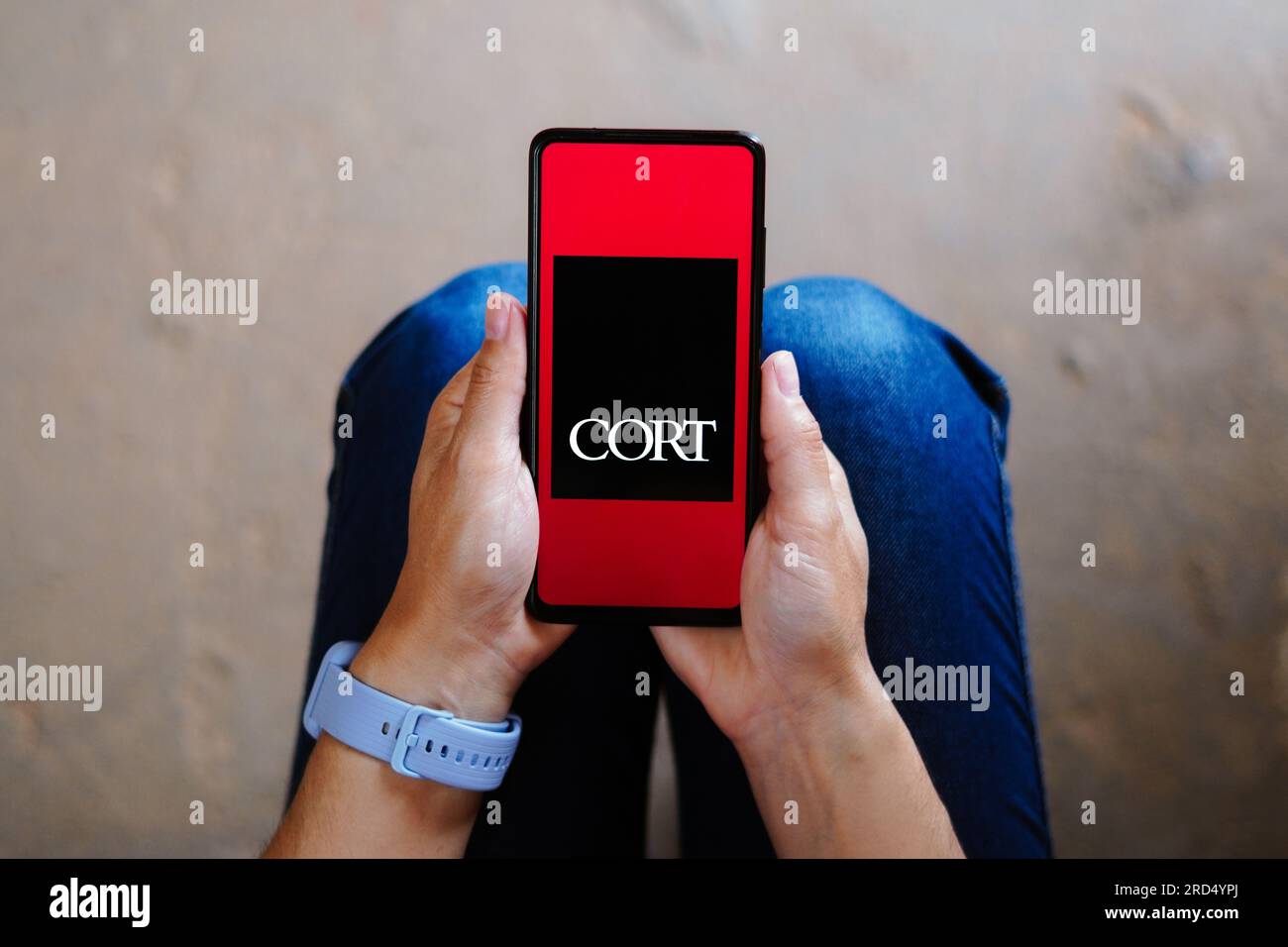 In this photo illustration, the CORT Furniture logo seen displayed on a ...