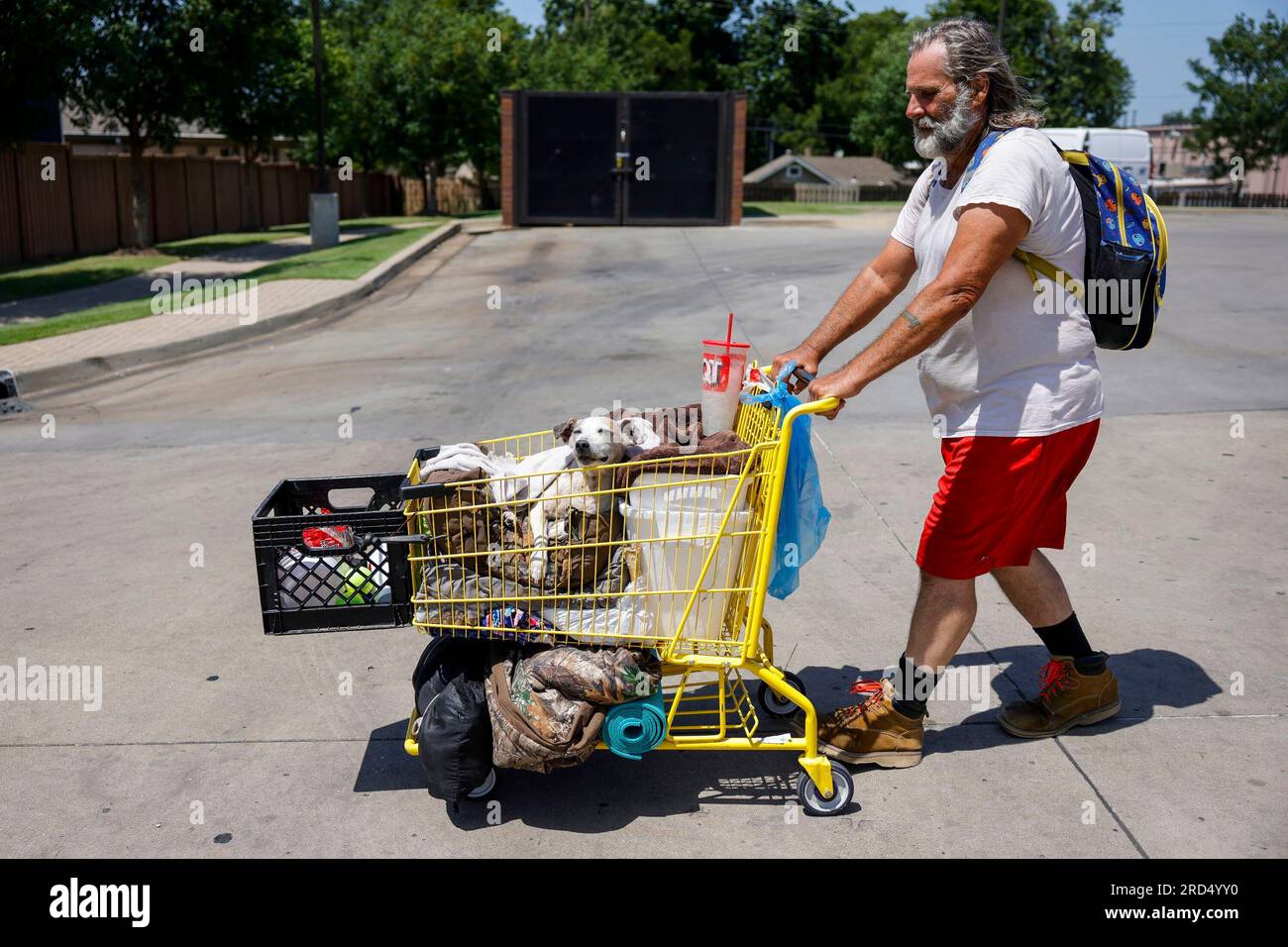 Bob Kukuk, who has been homeless for about 10 days, walks with his dog ...