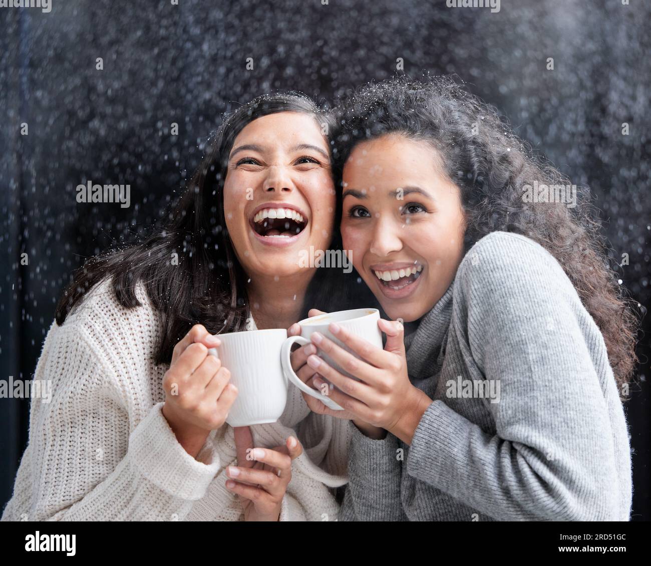 Women, friends and snowfall with coffee, laugh and happiness together ...