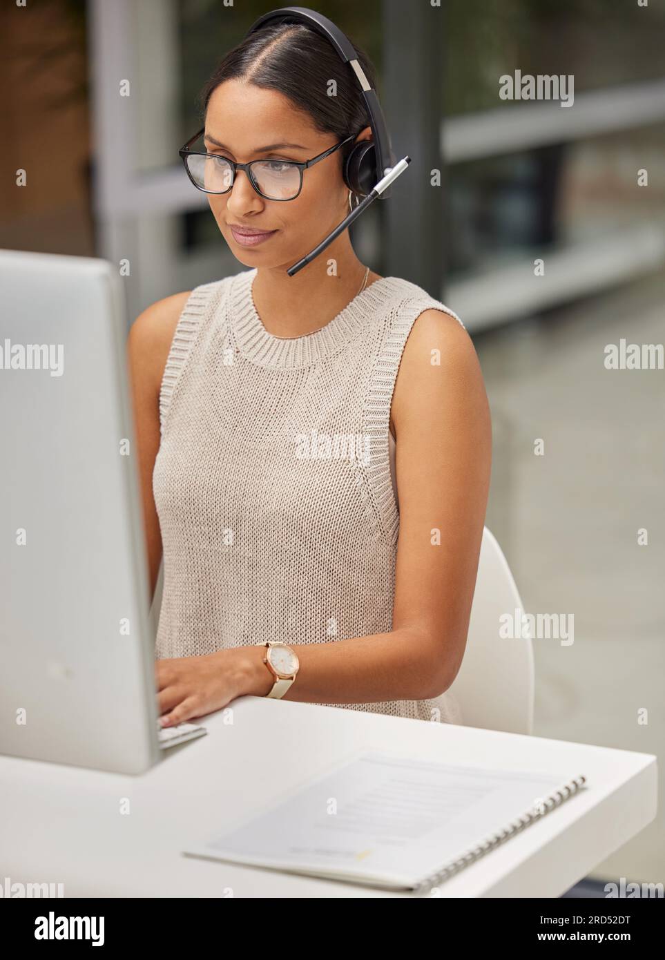 Business woman, call center and web support communication at a computer in a office. Phone ...