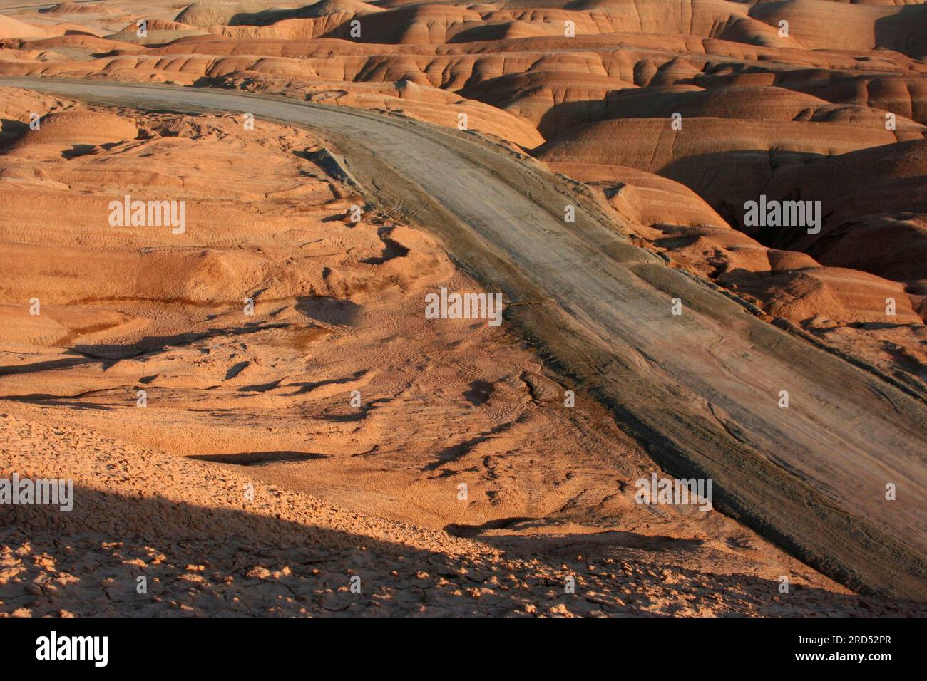 A German VW bus stands on a disused road in the Kavir Desert, Iran ...