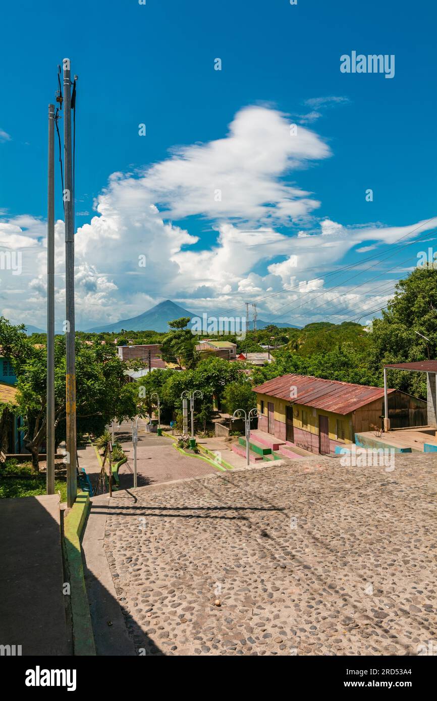 Streets of Nagarote with a view of the momotombo volcano on a beautiful ...