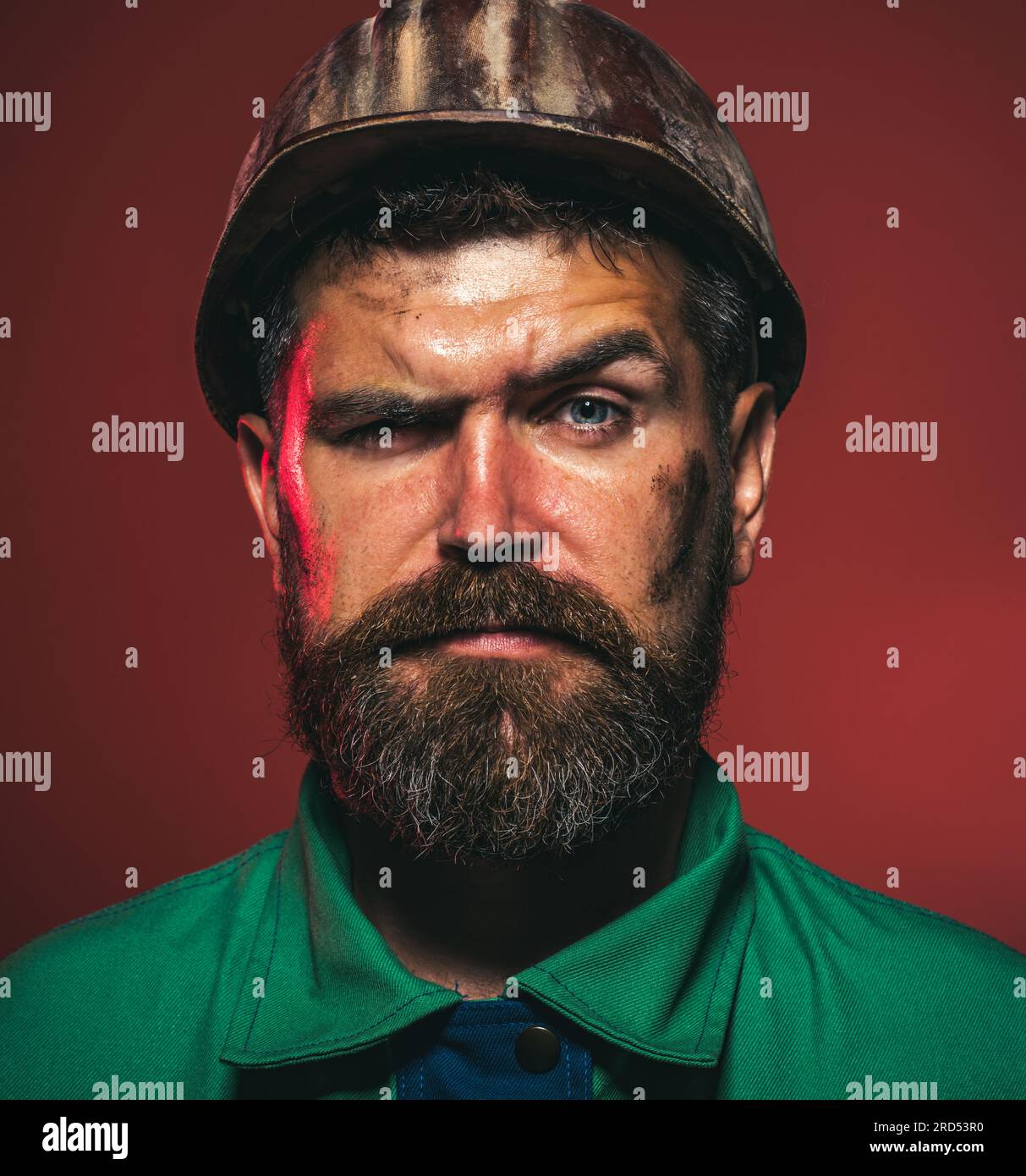 Industrial worker in safety helmet. Hard work. Closeup man in builder uniform in protective ...