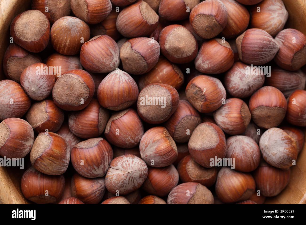 Whole hazelnuts in wooden shell Stock Photo - Alamy