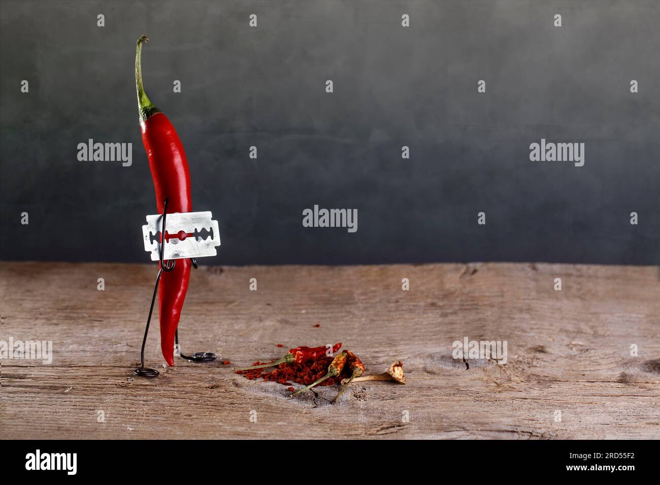Hot red chilli pepper with equally hot razor blade Stock Photo - Alamy