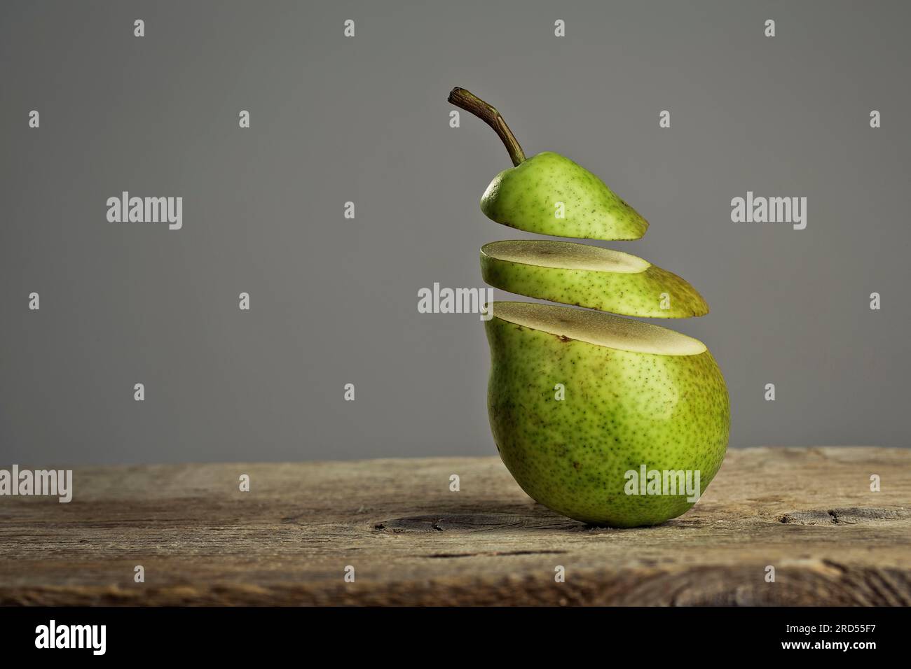 Pear cut into slices whose slices seem to float Stock Photo - Alamy
