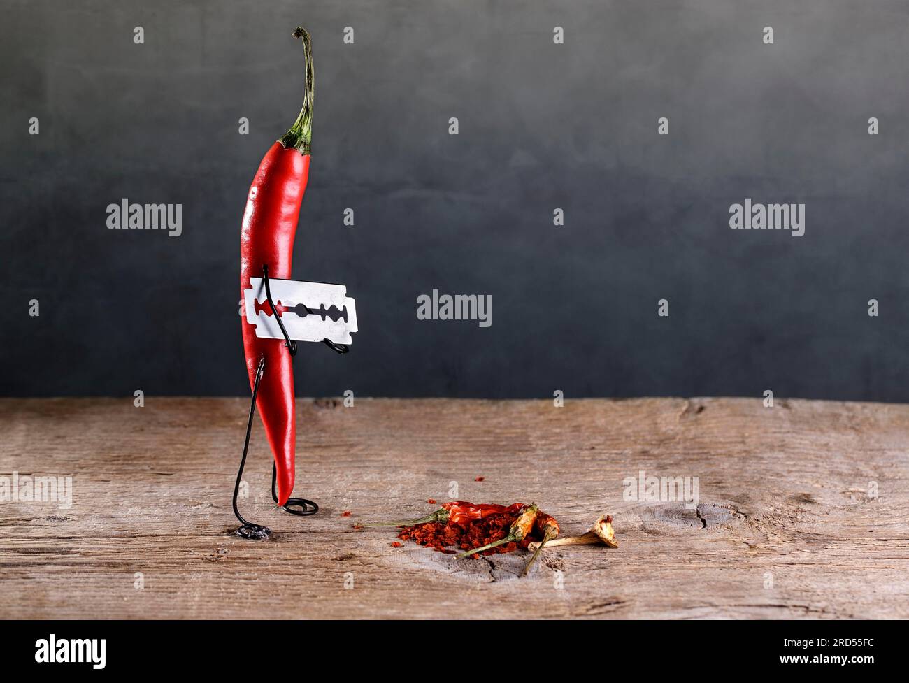 Hot red chilli pepper with equally hot razor blade Stock Photo - Alamy